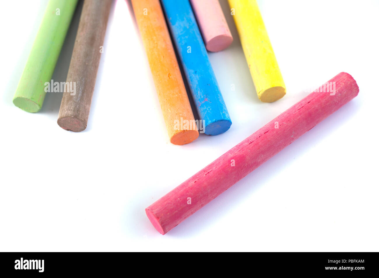 Colored chalks on white background with soft shadows Stock Photo - Alamy