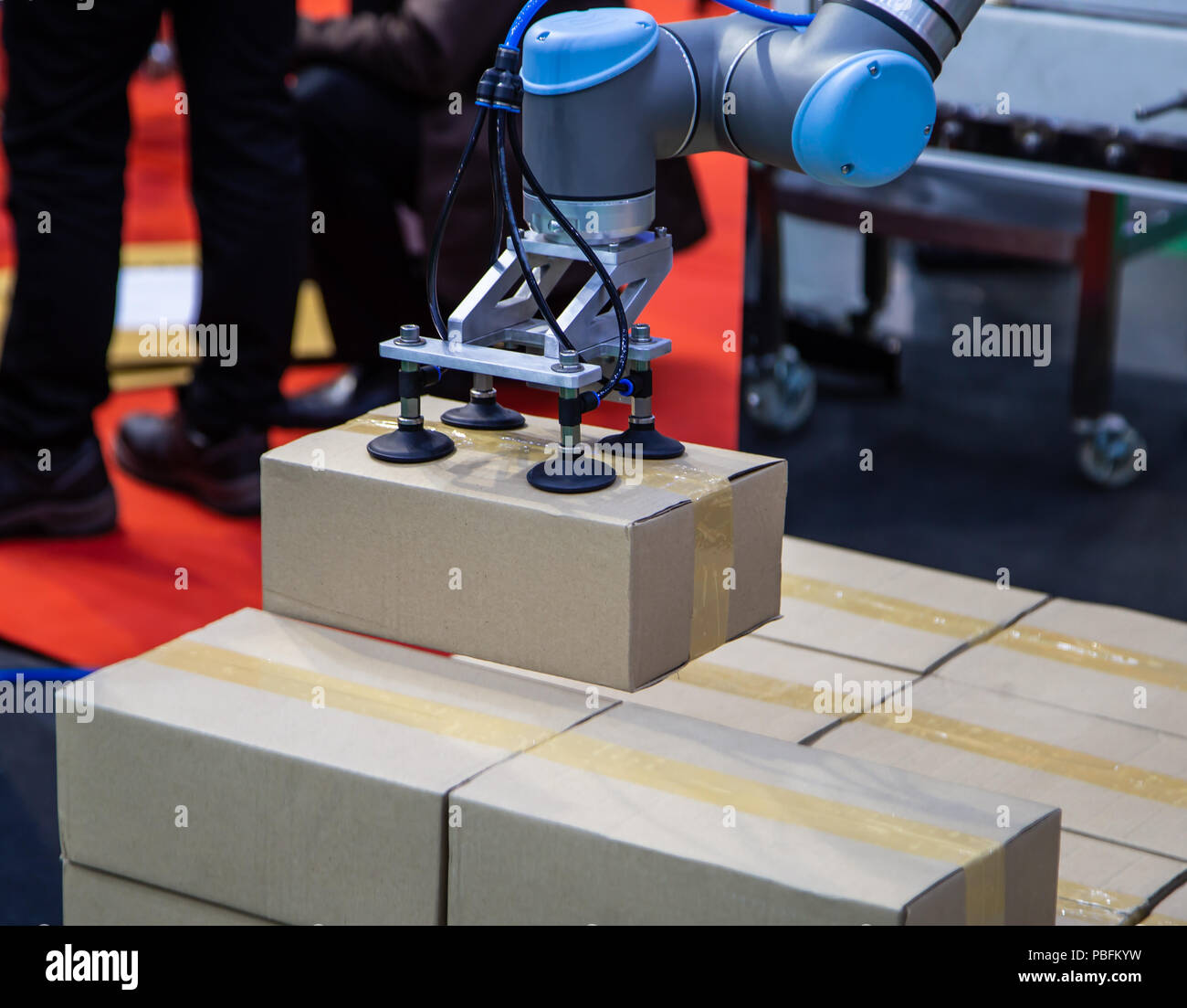 The Universal Robot collaborative industrial robot arm lifing box Stock ...