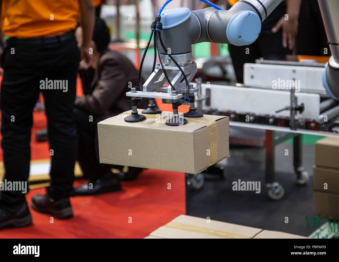 The Universal Robot collaborative industrial robot arm lifing box Stock ...