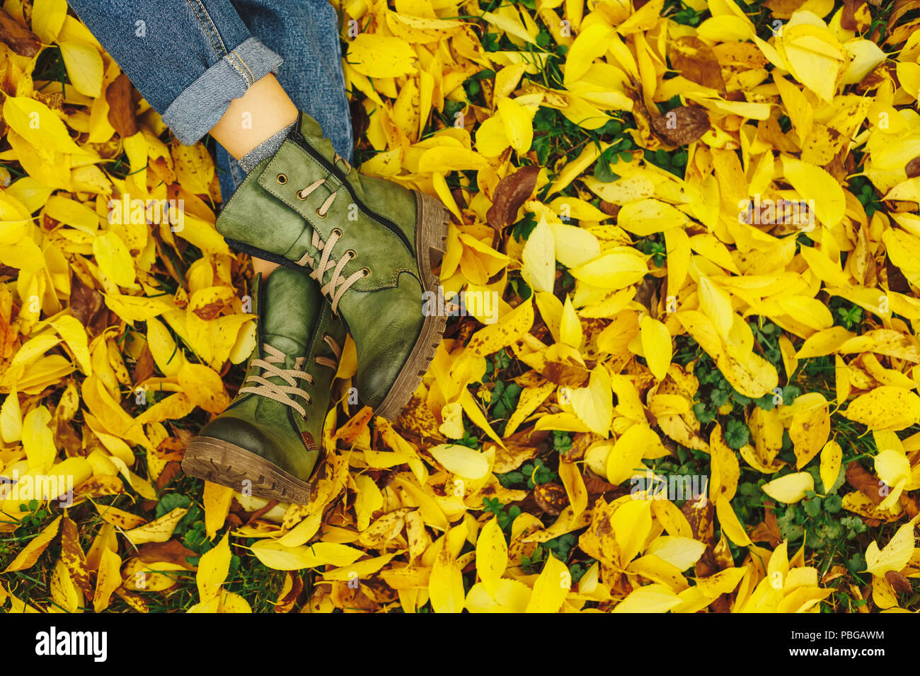 Shoes in yellow autumn leaves Stock Photo - Alamy