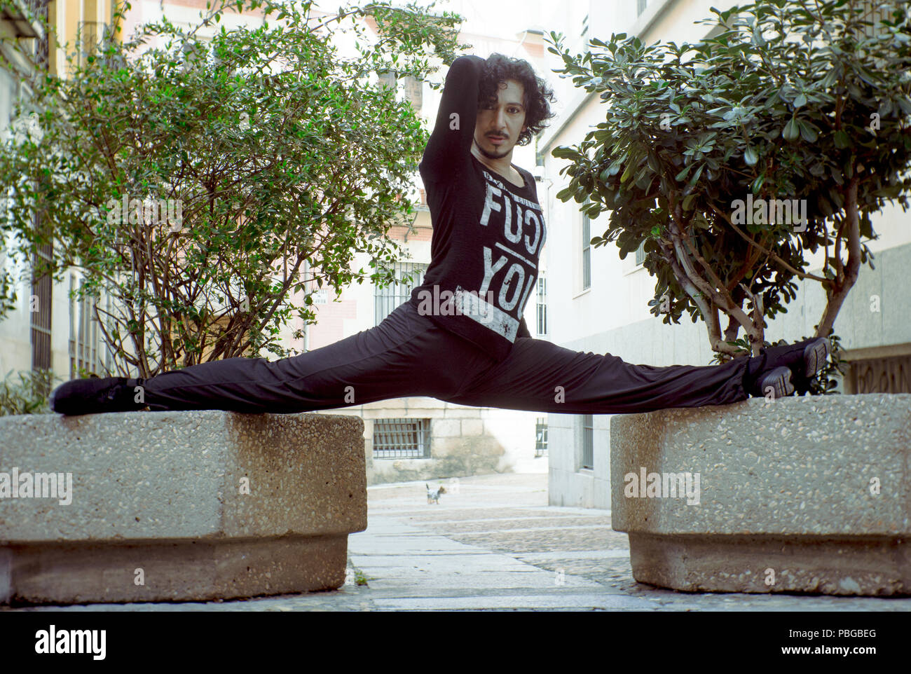 Male dancer in ballet pose. Street background Stock Photo - Alamy