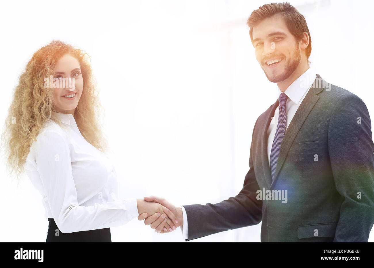 handshake Manager and client on blurred background Stock Photo - Alamy