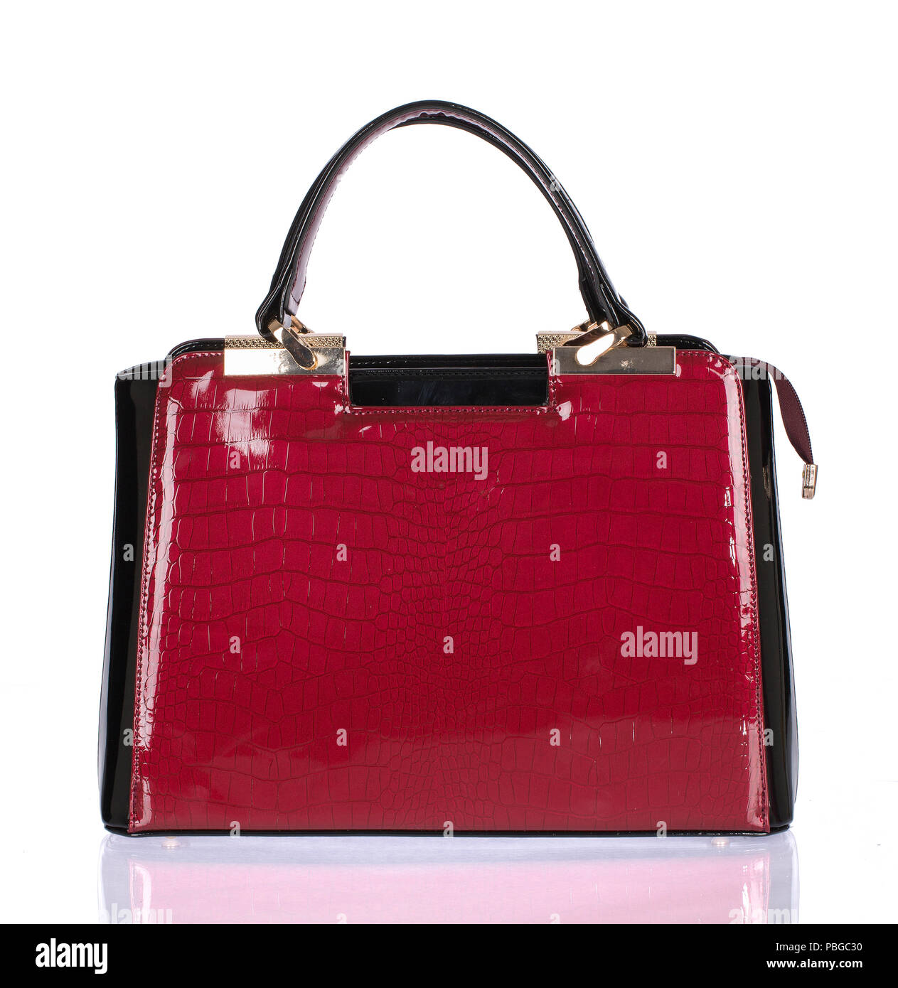 Elegant women red bag isolated on white background Stock Photo - Alamy