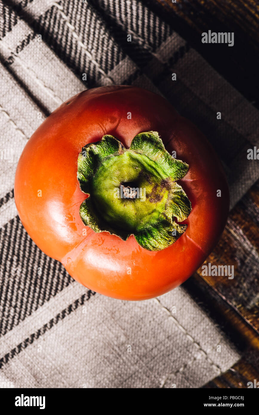 One persimmon on table hi-res stock photography and images - Alamy