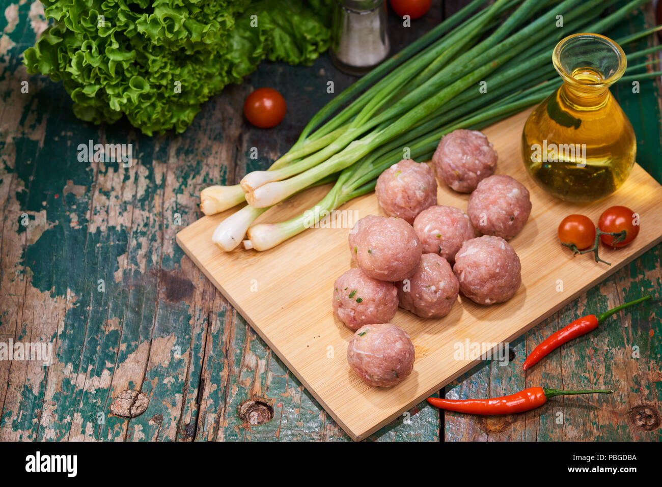 Homemade food. Raw fish ball (uncooked) in the kitchen with vegetables ...