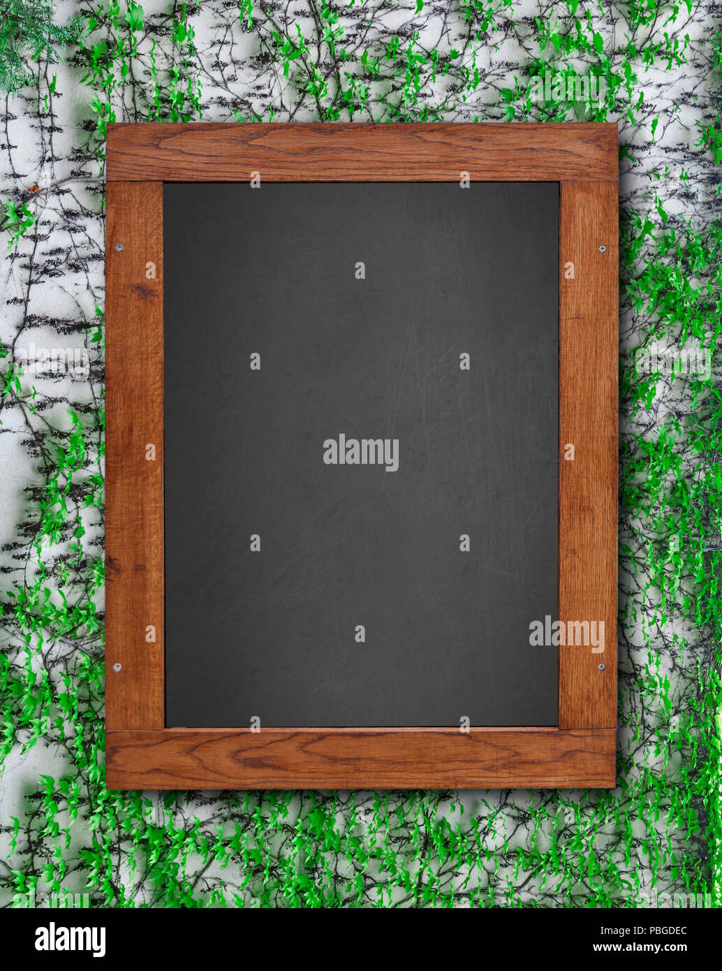Blackboard in wooden frame on wall Stock Photo - Alamy