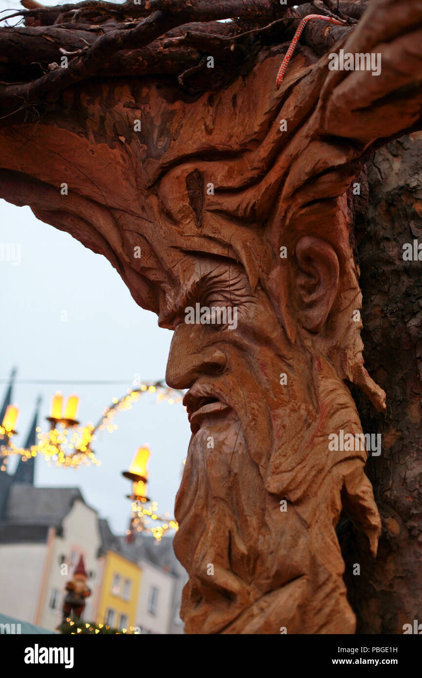 Wood carving of a mans face at a Christmas Market, Cologne, Germany ...