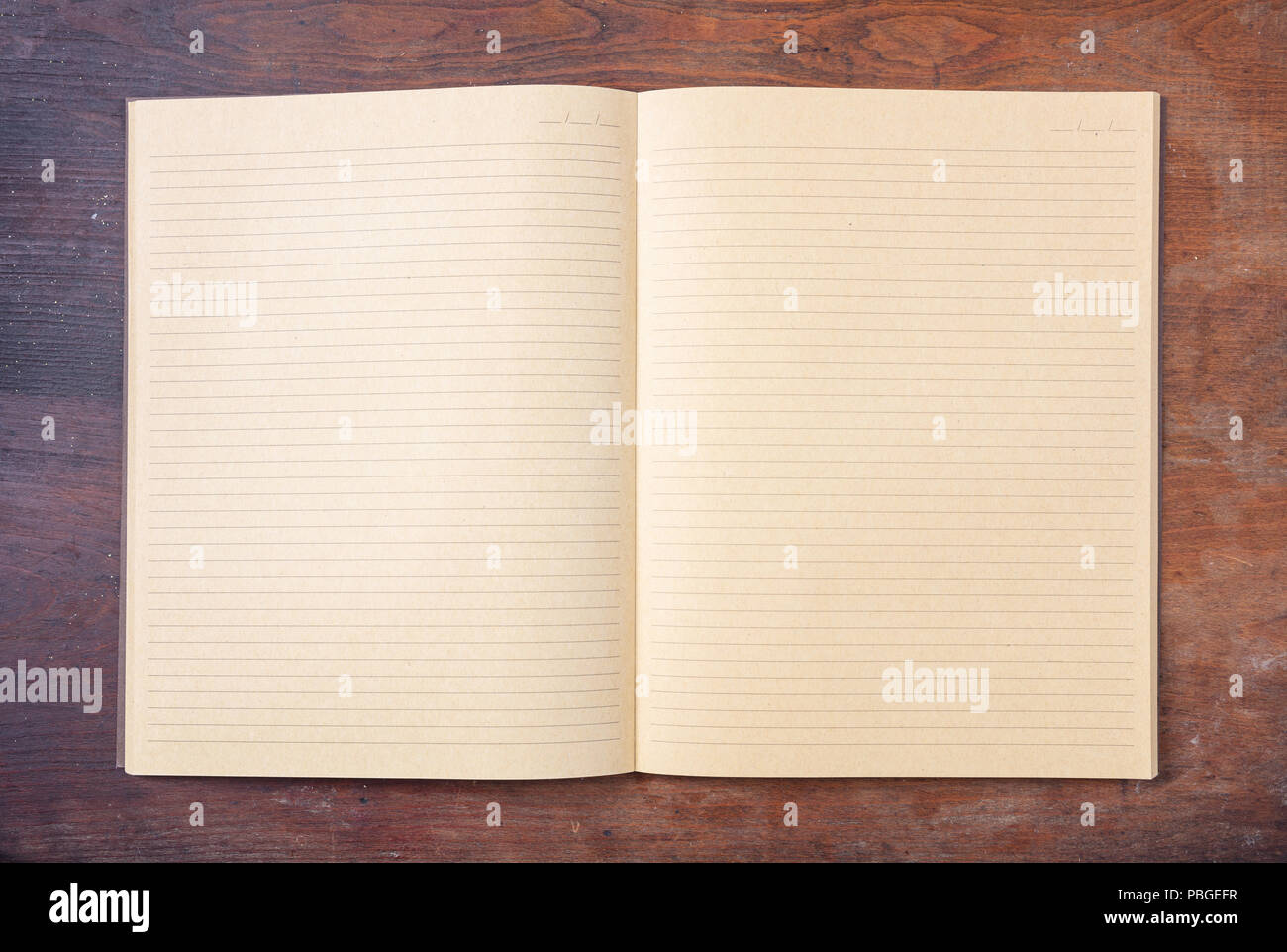 Open blank school notebook or diary, old fashioned, isolated on wooden ...