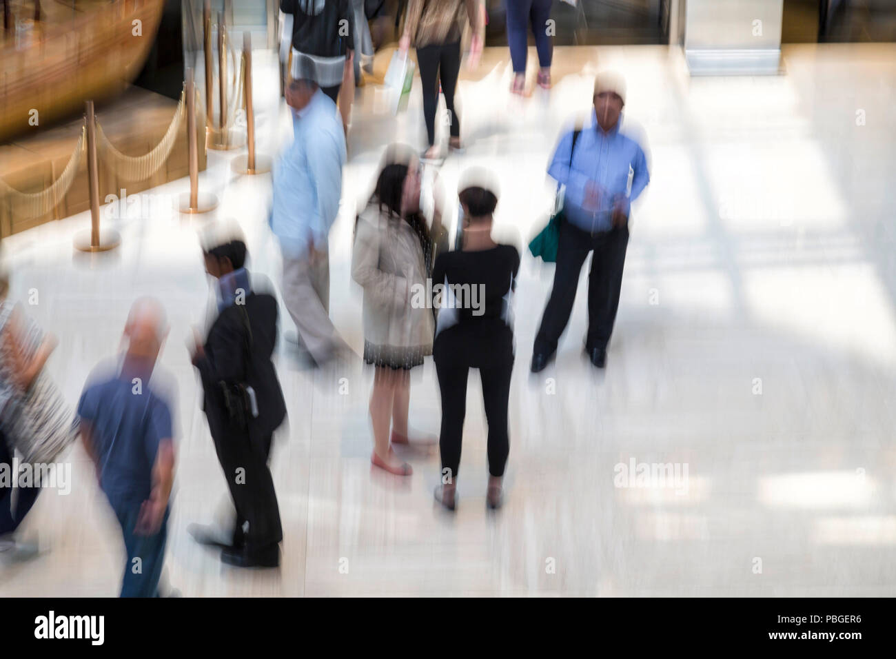 Motion blurred people in center Stock Photo - Alamy