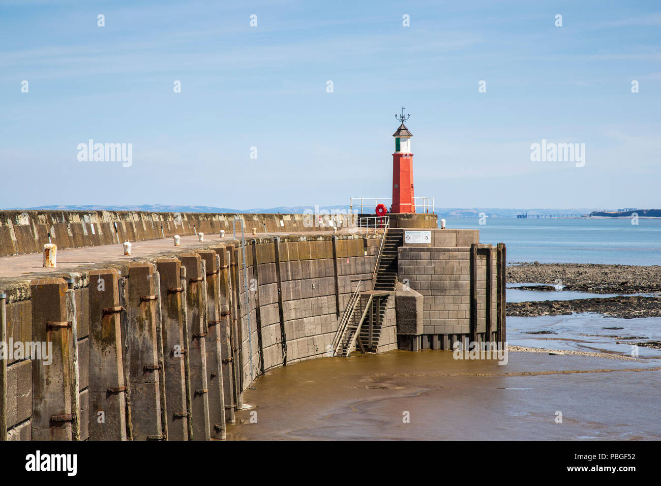 Watchet, Somerset, the harbour entrance and the lighthouse Stock Photo ...