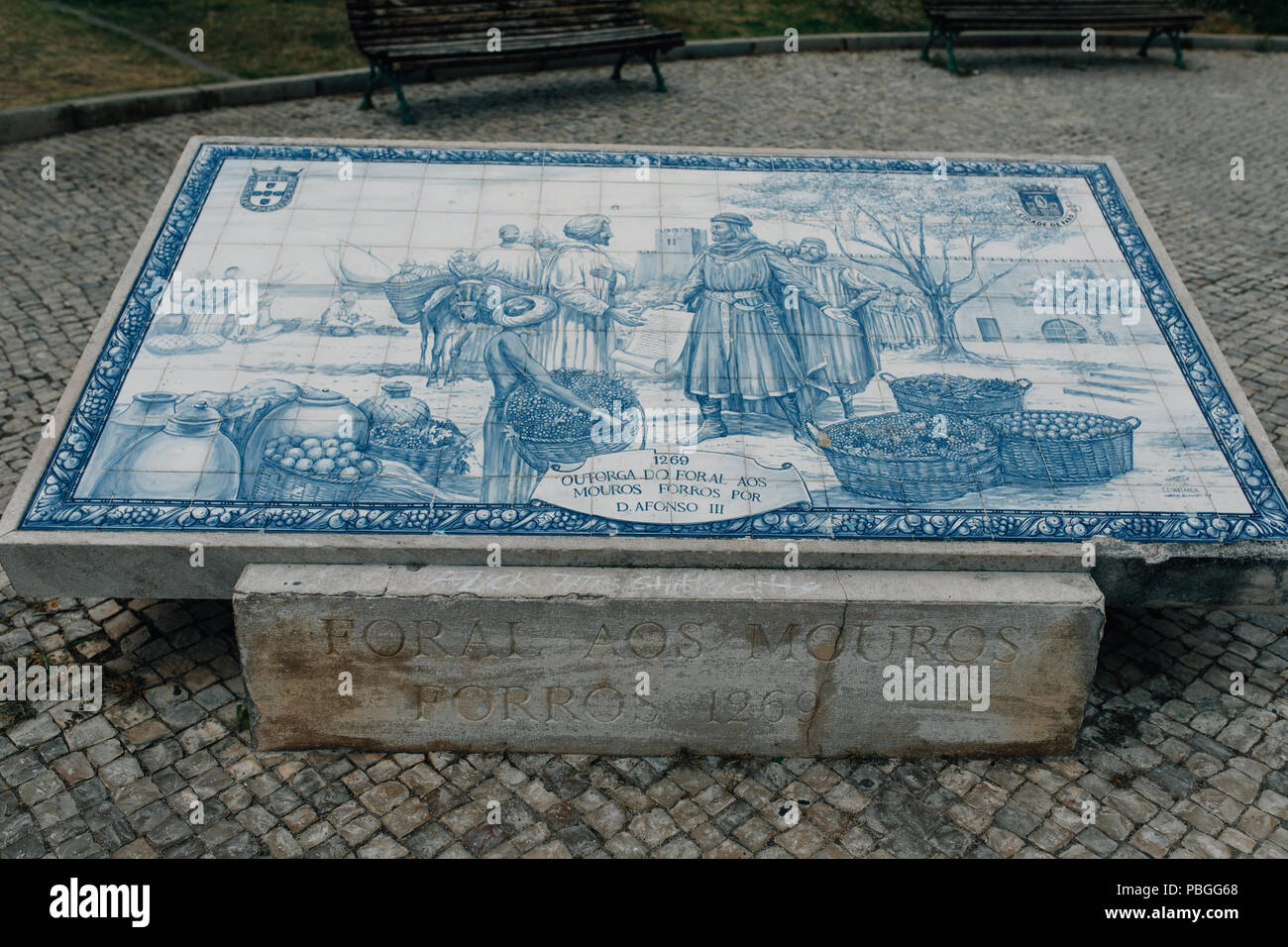 Azulejo tile plate with historic snene on public square in Faro city ...