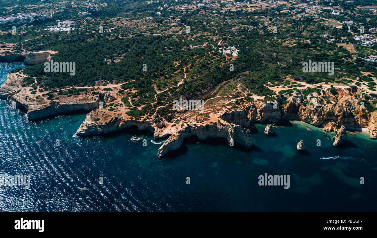Beautiful rocks and cliff beaches of Portugal coastline from above ...