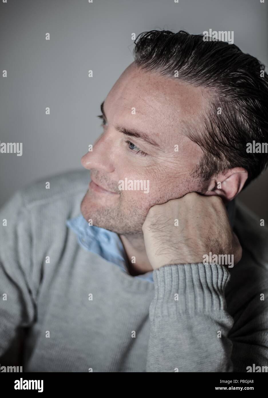 portrait of a handsome man looking into the distance Stock Photo - Alamy
