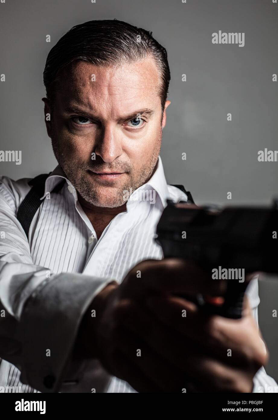 Man gun tuxedo hi-res stock photography and images - Alamy