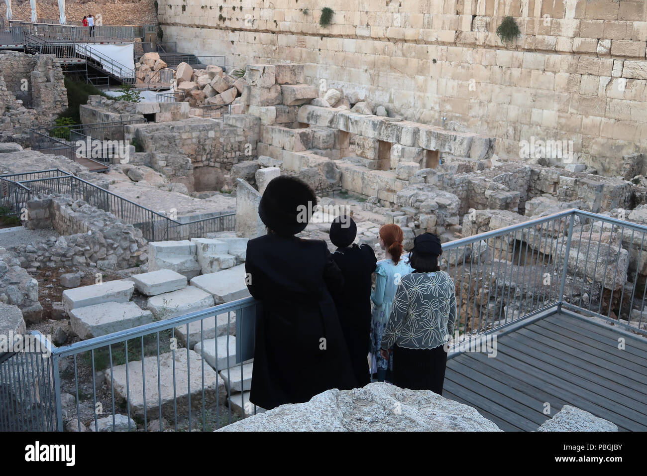 An Ultra Orthodox Jewish family looking at Herodian ruins along the ...