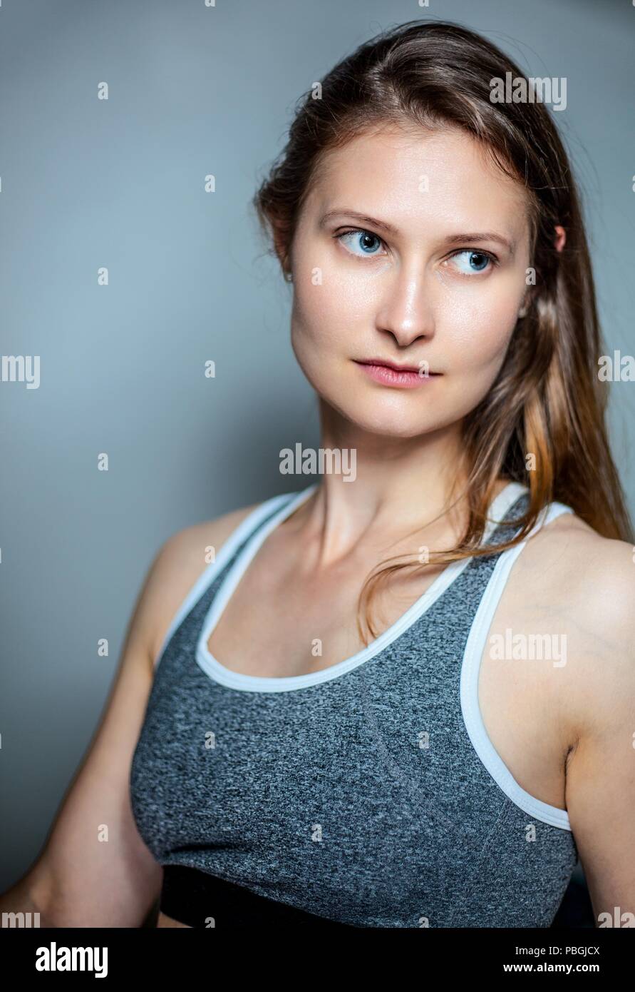 portrait of a young woman in a fitness bra Stock Photo - Alamy