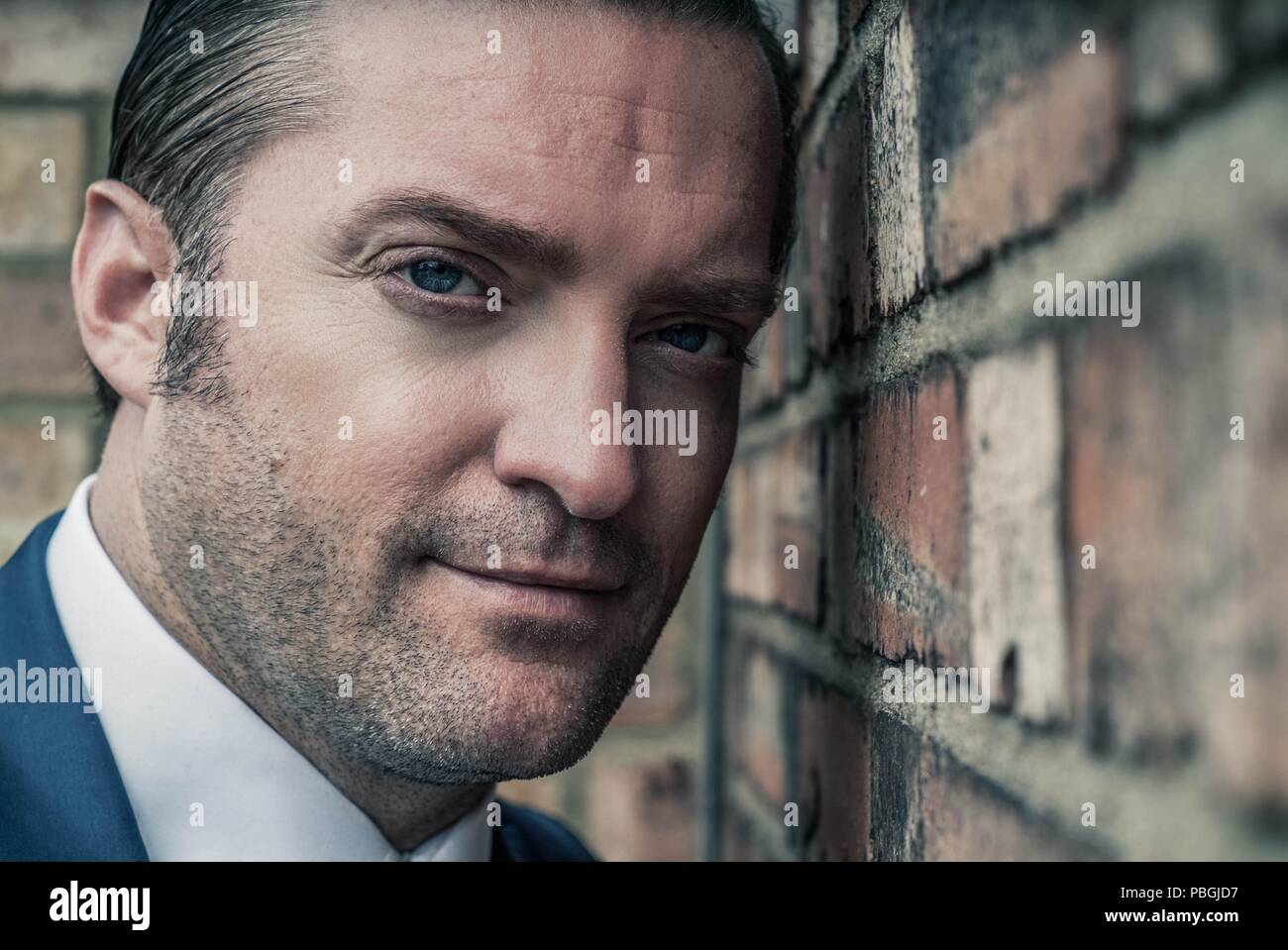 closeup portrait of a handsome man in a smart suit Stock Photo - Alamy