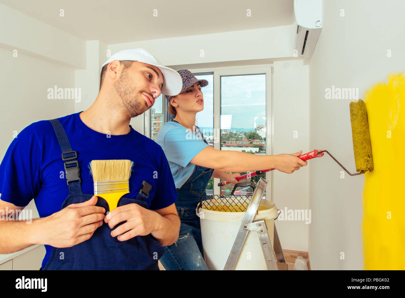 Couple renovate their living room from white to yellow with paint stick ...