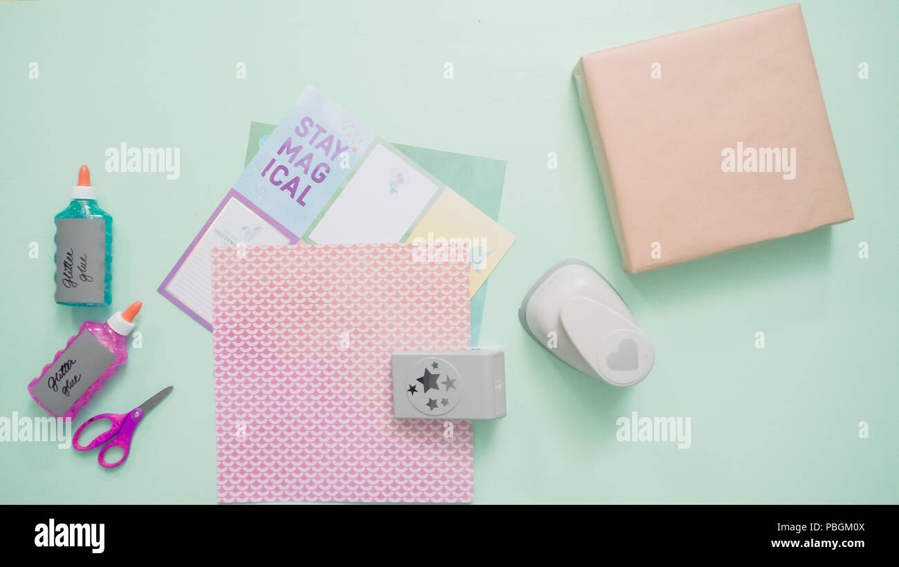 Decorating present for kids birthday with craft paper Stock Photo - Alamy