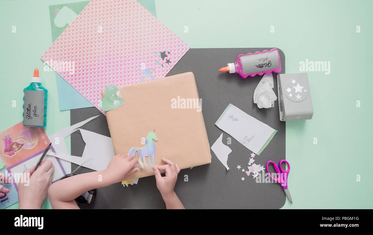 Decorating present kids birthday craft hi-res stock photography and ...