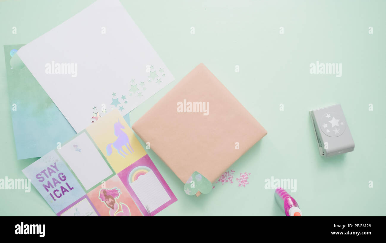 Decorating present for kids birthday with craft paper Stock Photo - Alamy