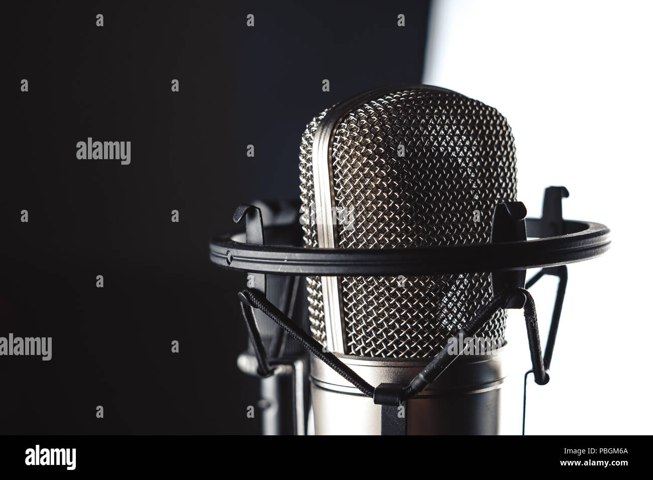 Studio microphone and microphone stand on white background Stock Photo ...