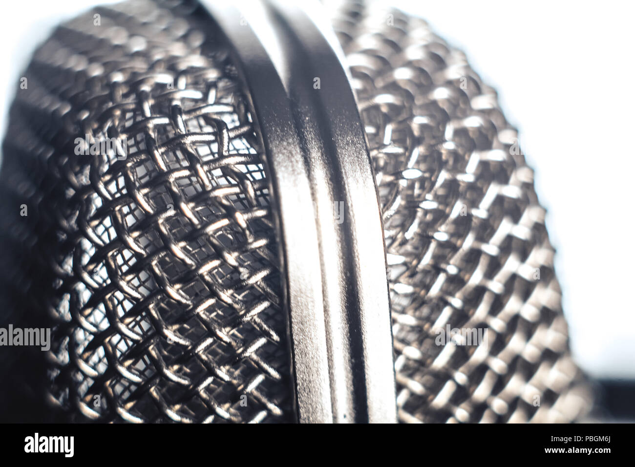 metal microphone Grille, white background macro photography Stock Photo ...