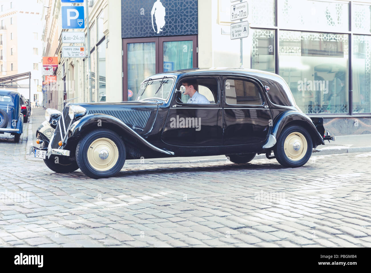 City Riga, Latvia. Oldtimer car festival at capital Riga. Urban city ...