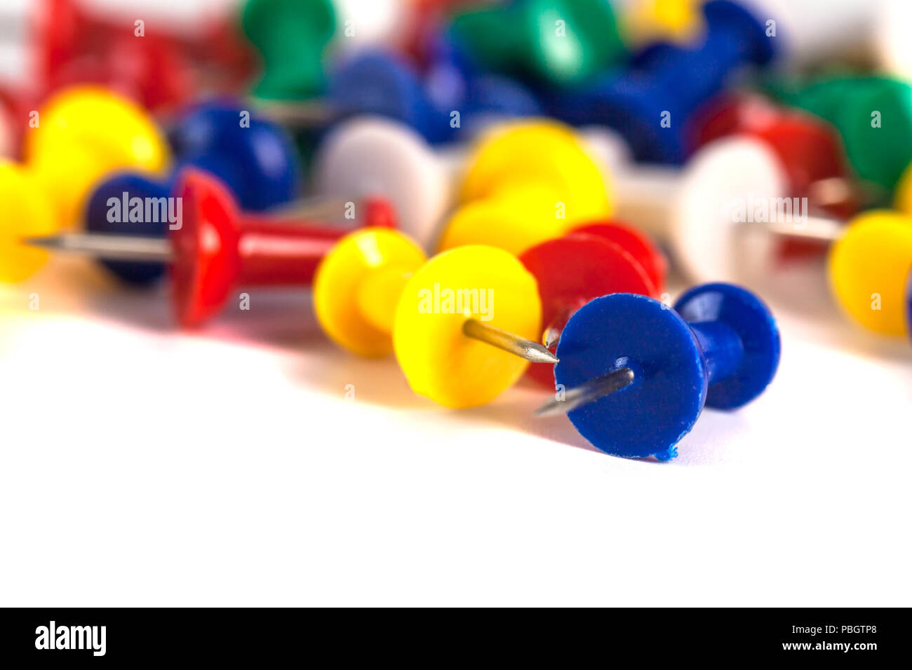 Mark pin pile on the white background in office, tacks Stock Photo - Alamy