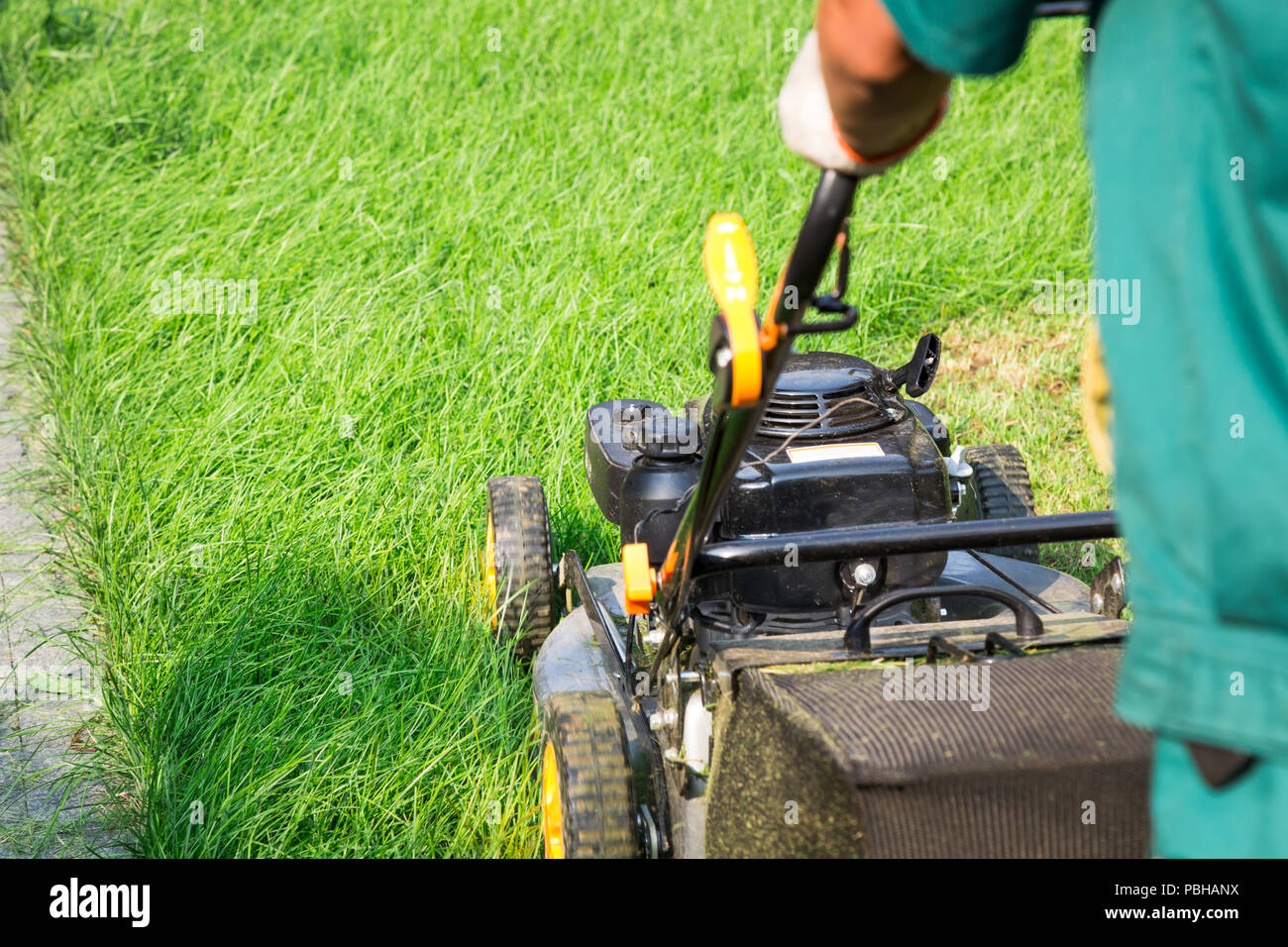 Lawn mower. Cutting, gardener Stock Photo - Alamy