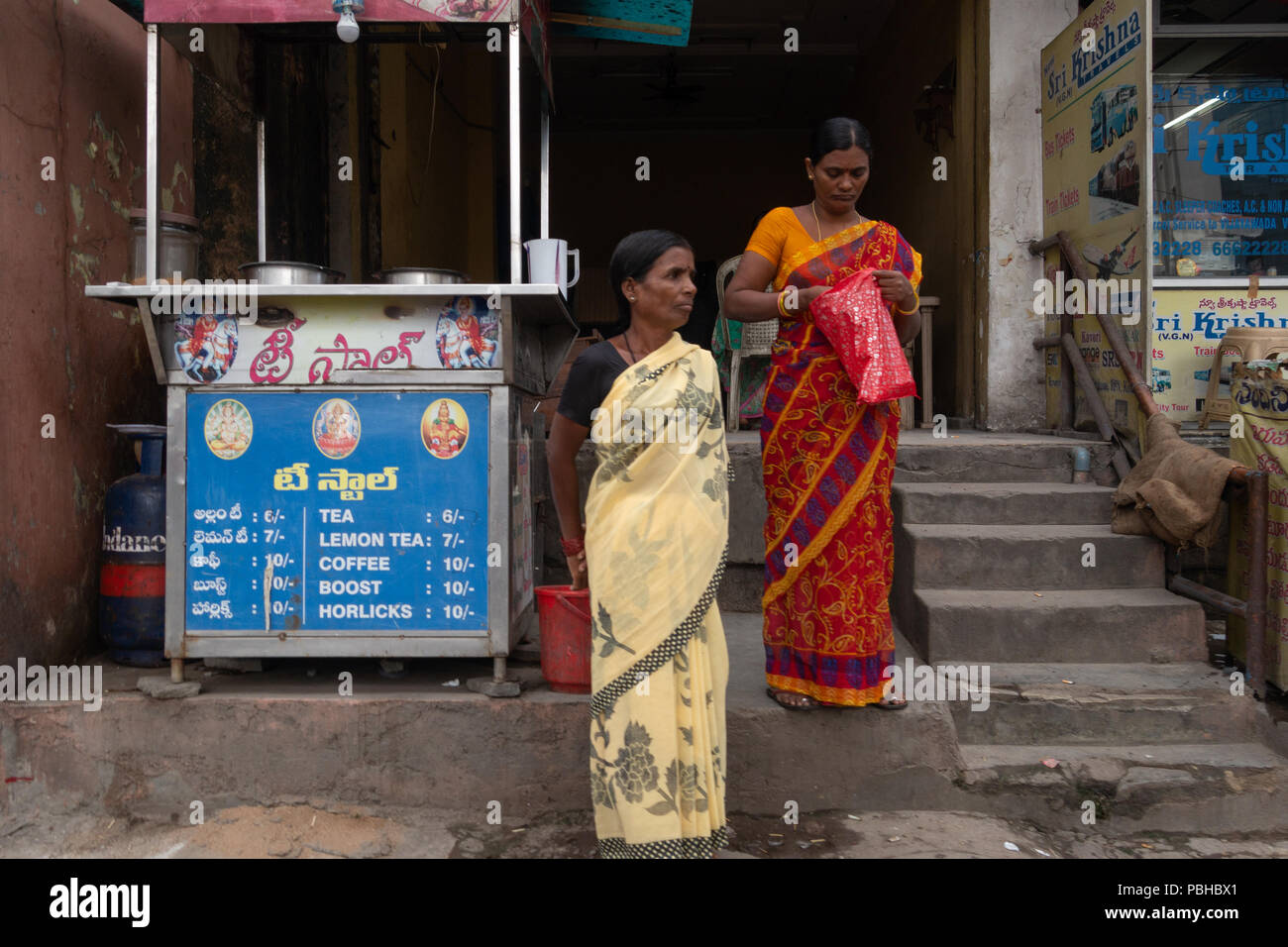 Two indian women waiting in front of a cafe in Hyderabad,India Stock ...