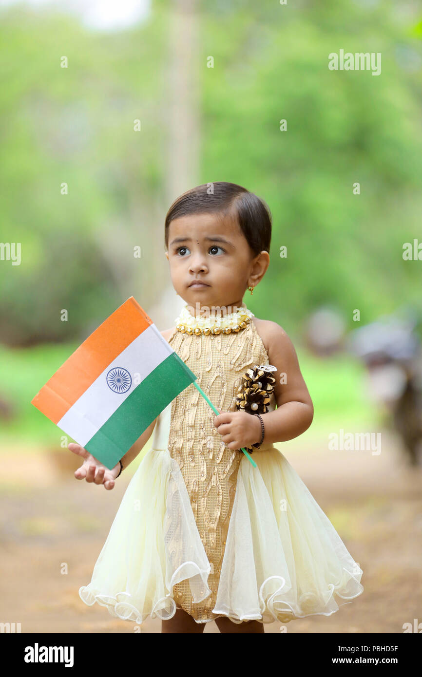 indian girl child holding indian flag Stock Photo - Alamy