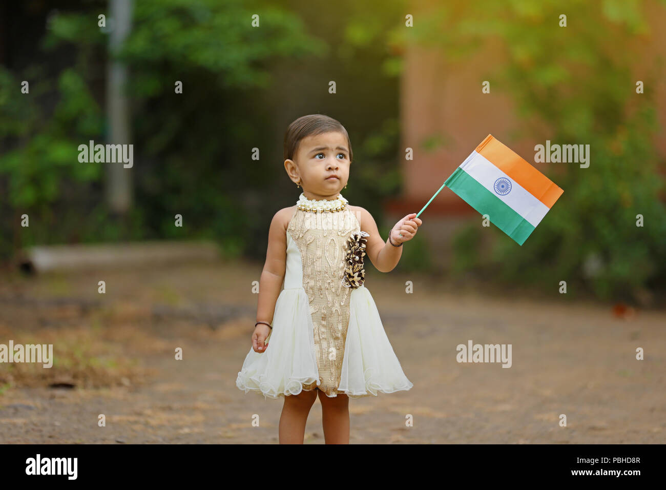 indian girl child holding indian flag Stock Photo - Alamy