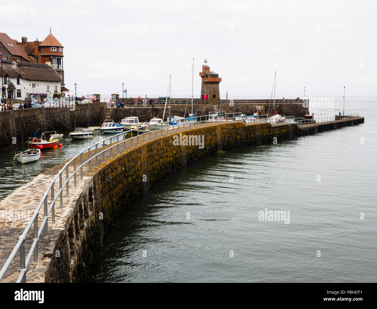 Curved sea wall at Lynmouth, Devon, UK, protects the fishing and ...