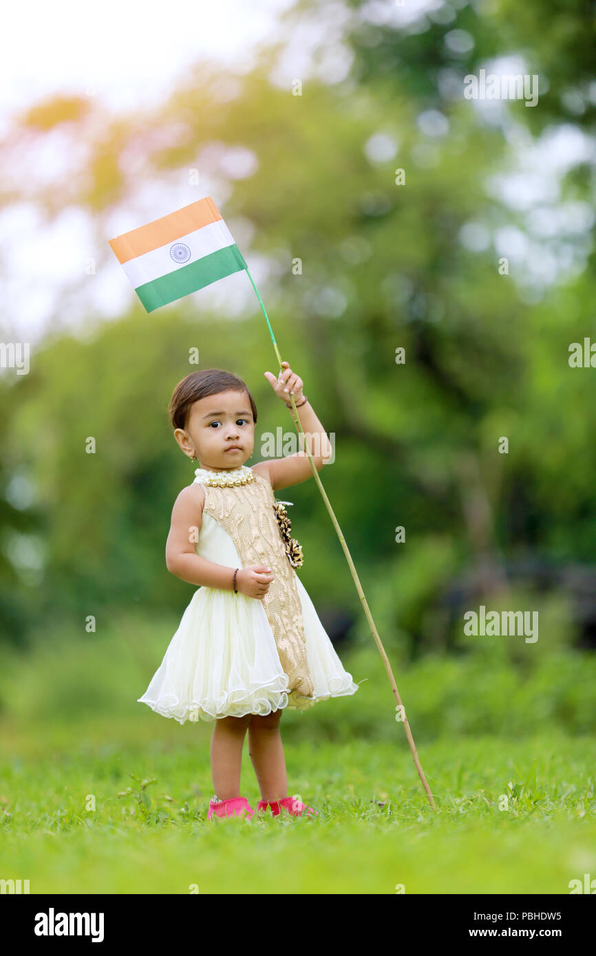 indian girl child holding indian flag Stock Photo - Alamy