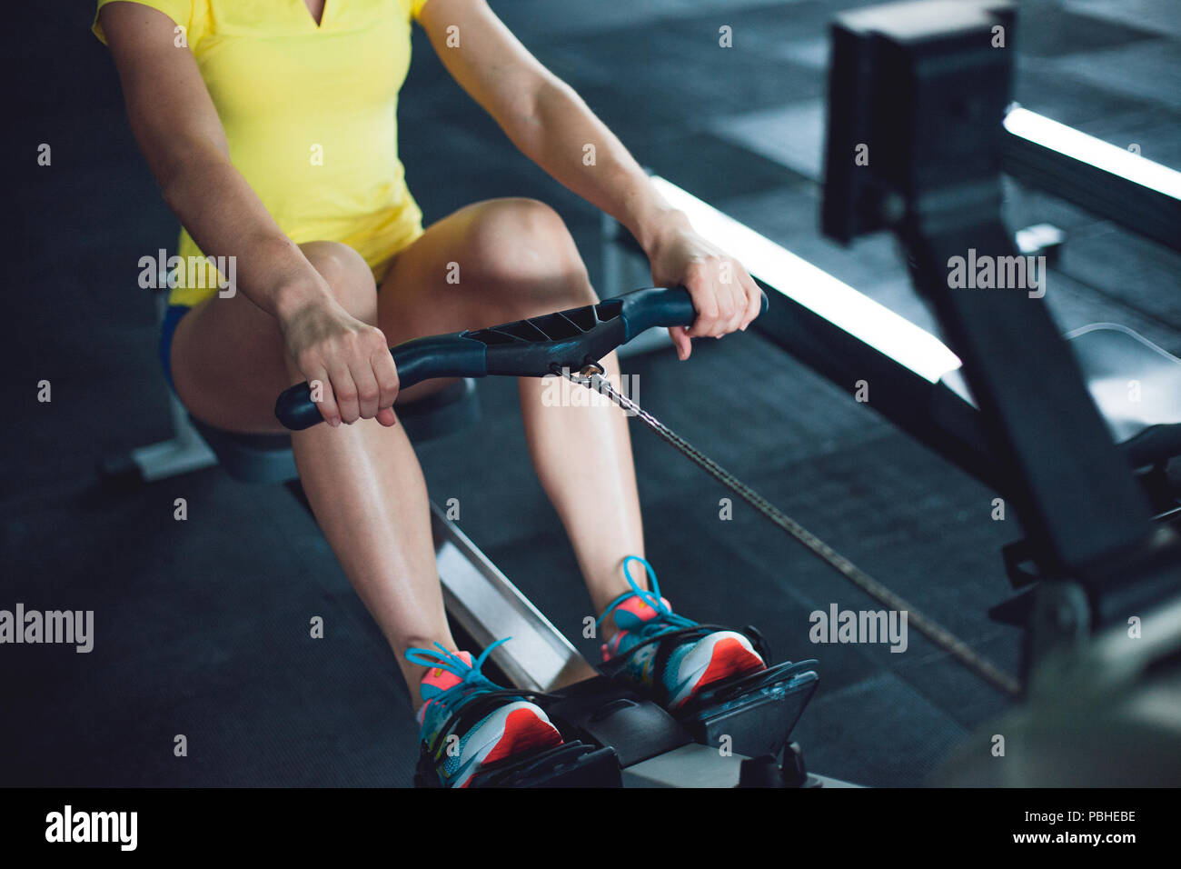 One woman indoor rowing machine hi-res stock photography and images - Alamy