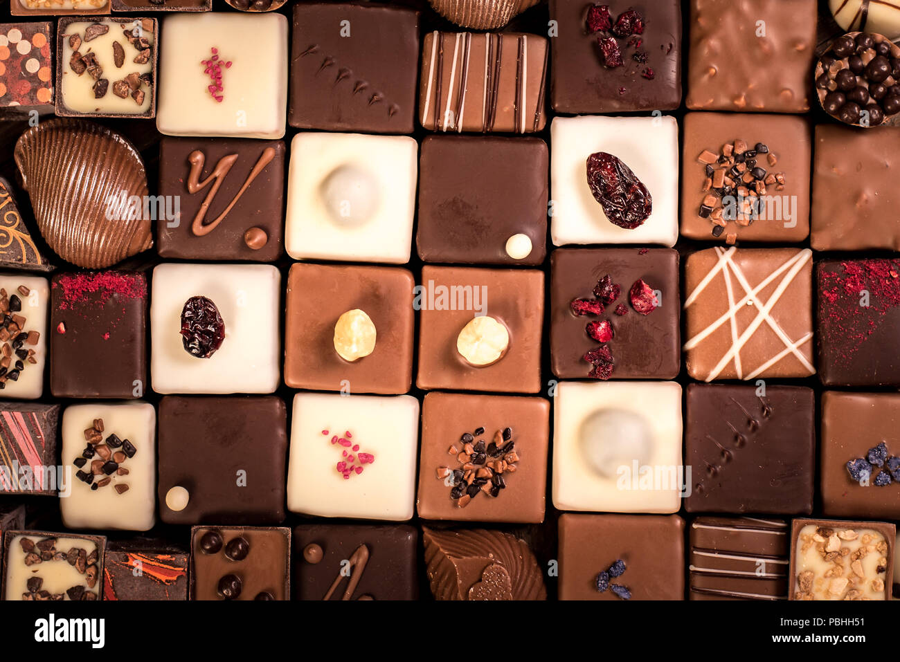 Assortment of fine chocolate candies, white, dark and milk chocolate ...