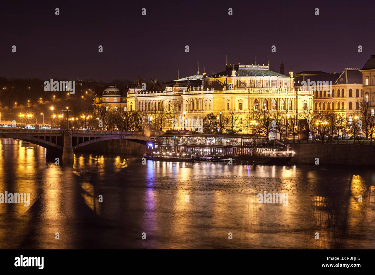 Rudolfinum concert hall at the Vltava riverbank by night Stock Photo ...