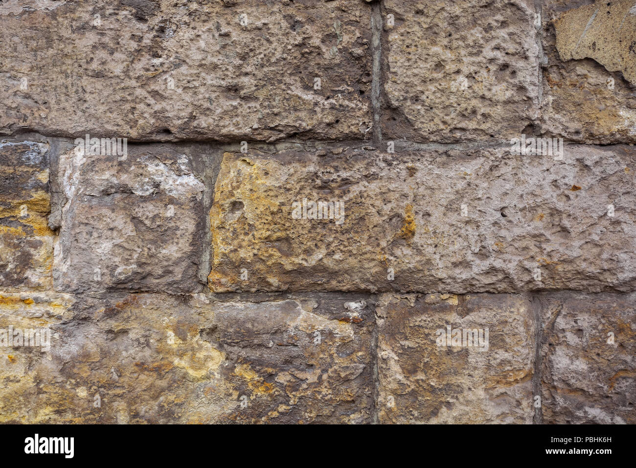 Stone wall background Wall made of cavern rock Stock Photo - Alamy