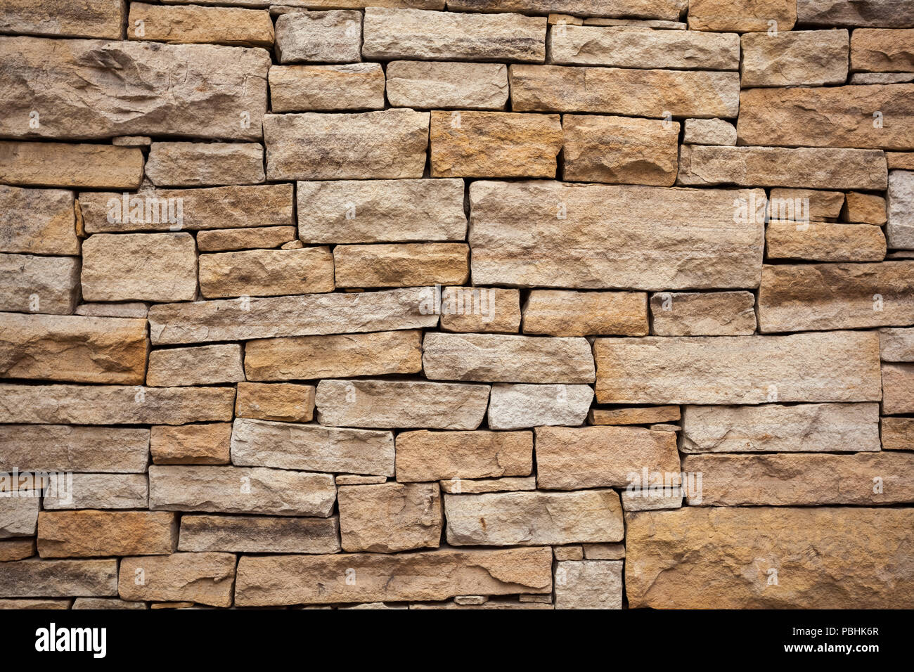 Stone wall background Wall made of cavern rock Stock Photo - Alamy