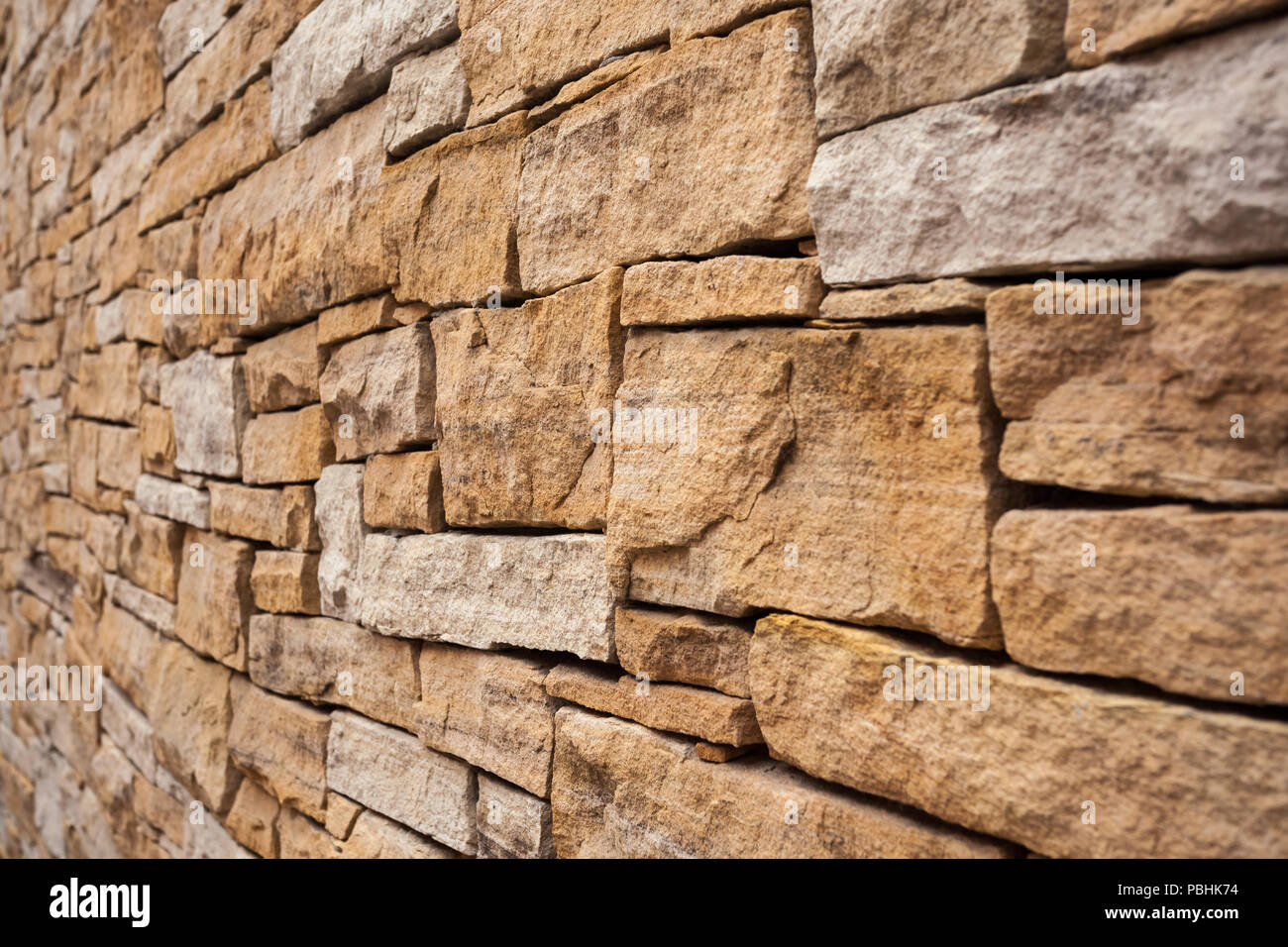 Stone wall background Wall made of cavern rock Stock Photo - Alamy