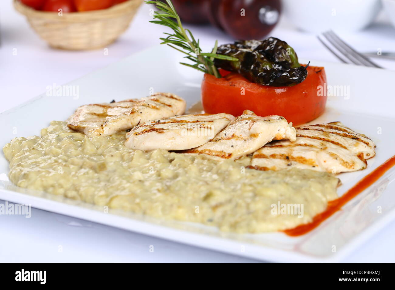 Grill fish fillet with tarator, humus Stock Photo - Alamy