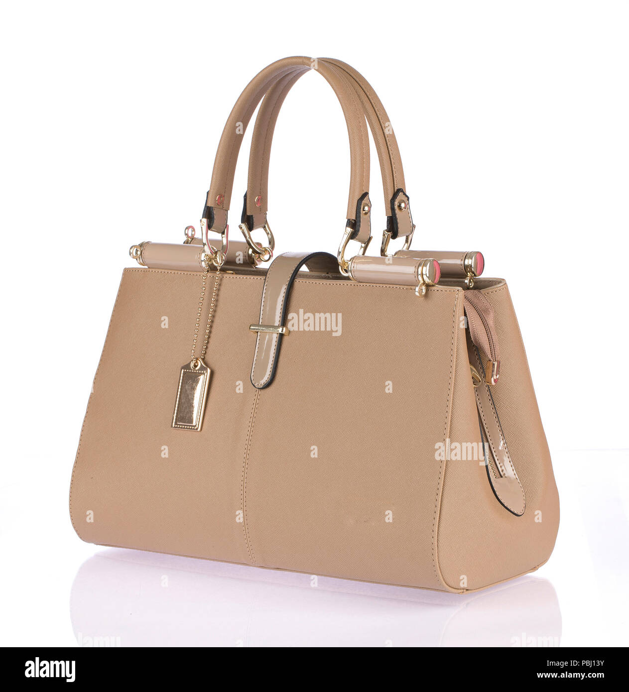 Elegant women beige bag on white background Stock Photo - Alamy
