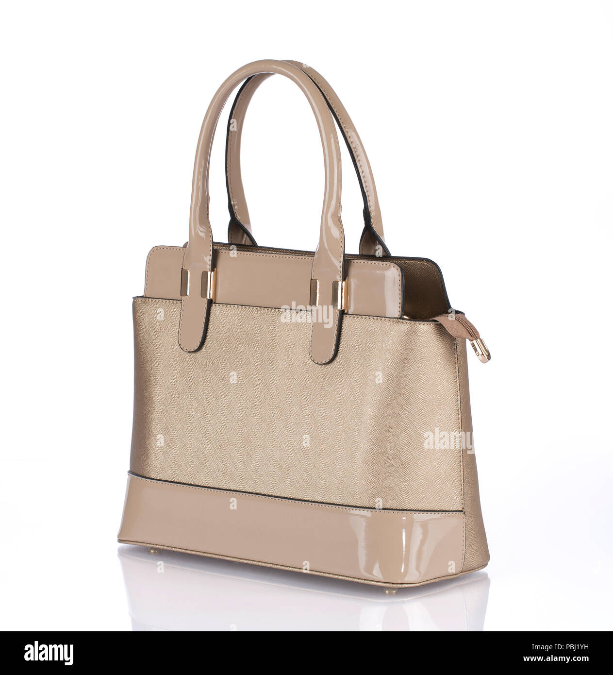 Elegant women beige bag on white background Stock Photo - Alamy