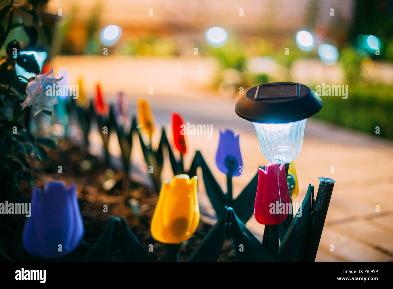 Small Solar Garden Light, Lantern In Flower Bed. Garden Design. Solar ...