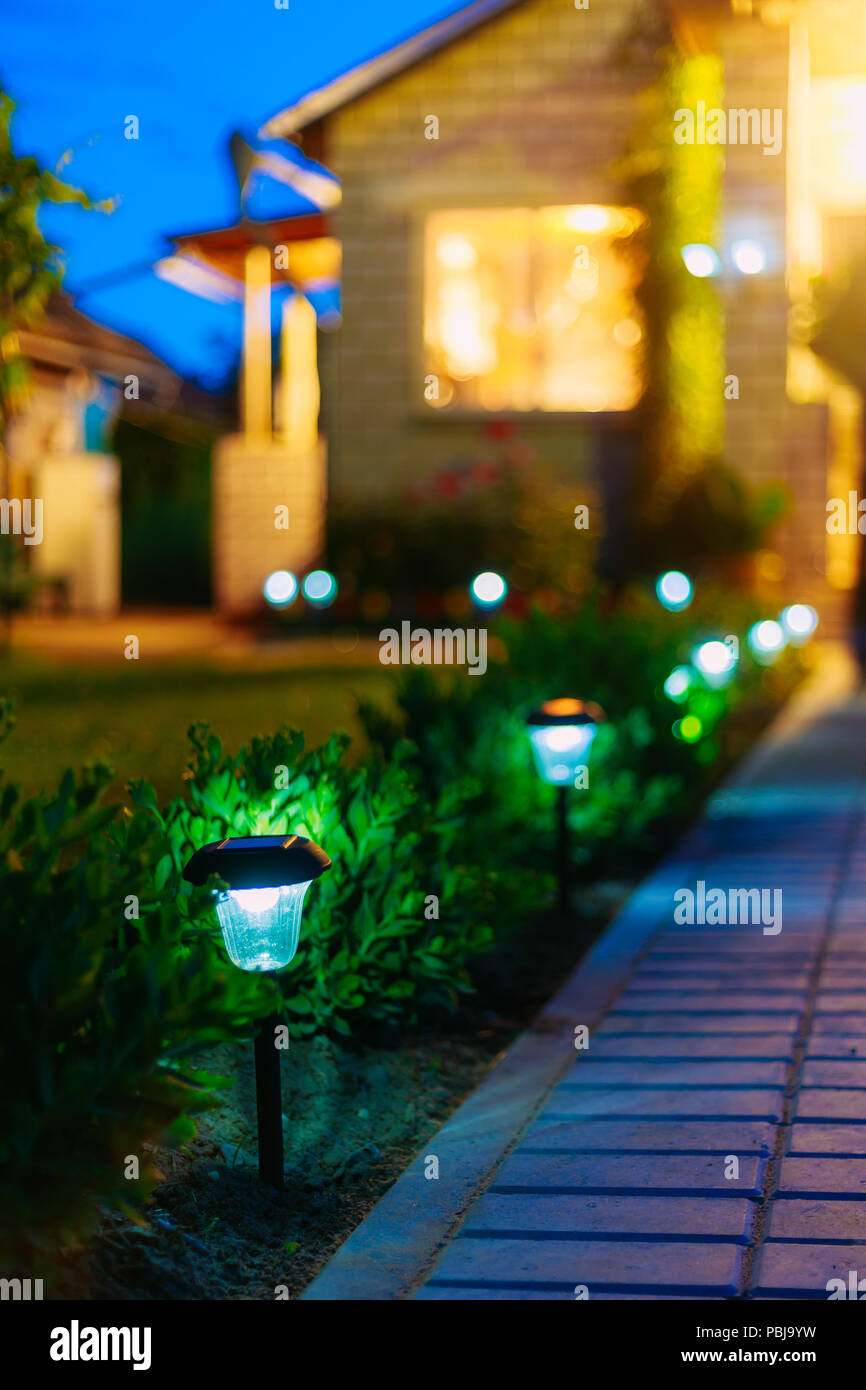 Small Solar Garden Light, Lanterns In Flower Bed. Garden Design. Solar ...