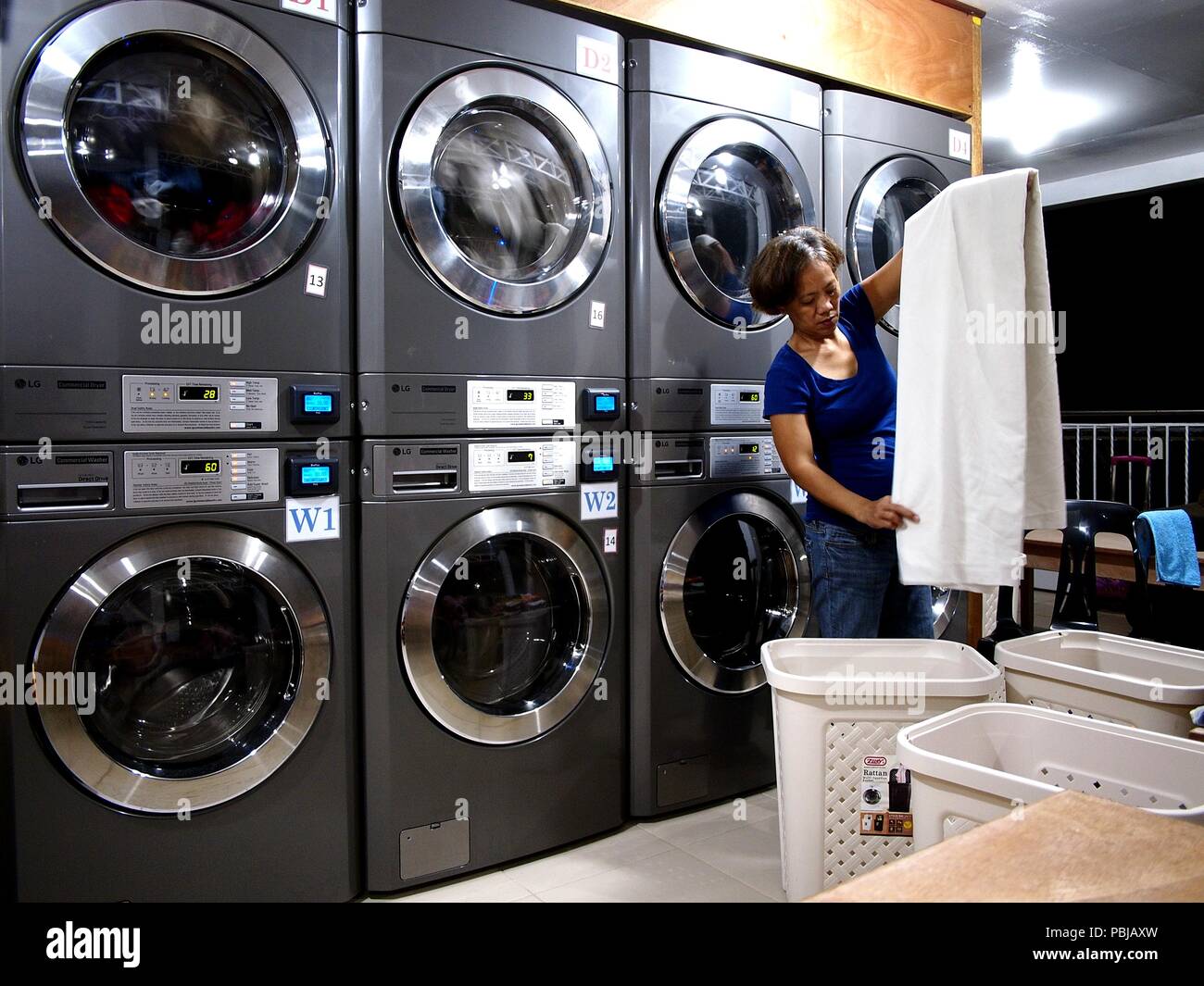 Laundry employee hi-res stock photography and images - Alamy