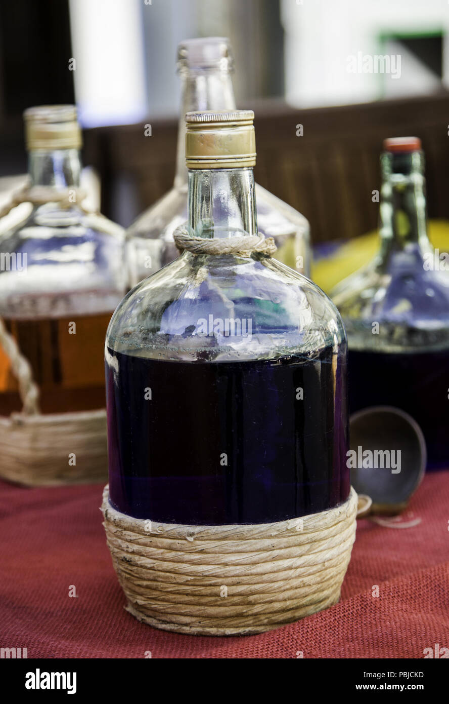 Bottles with colored liquid, detail of colors and glass, containers ...