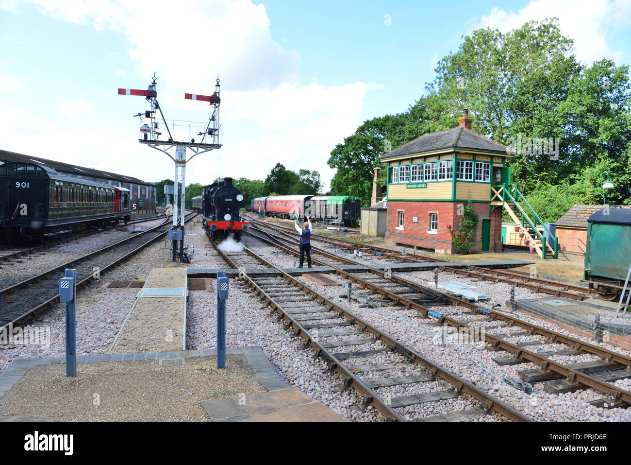 A Q class steam engine pulling into Horsted Keynes station Stock Photo ...