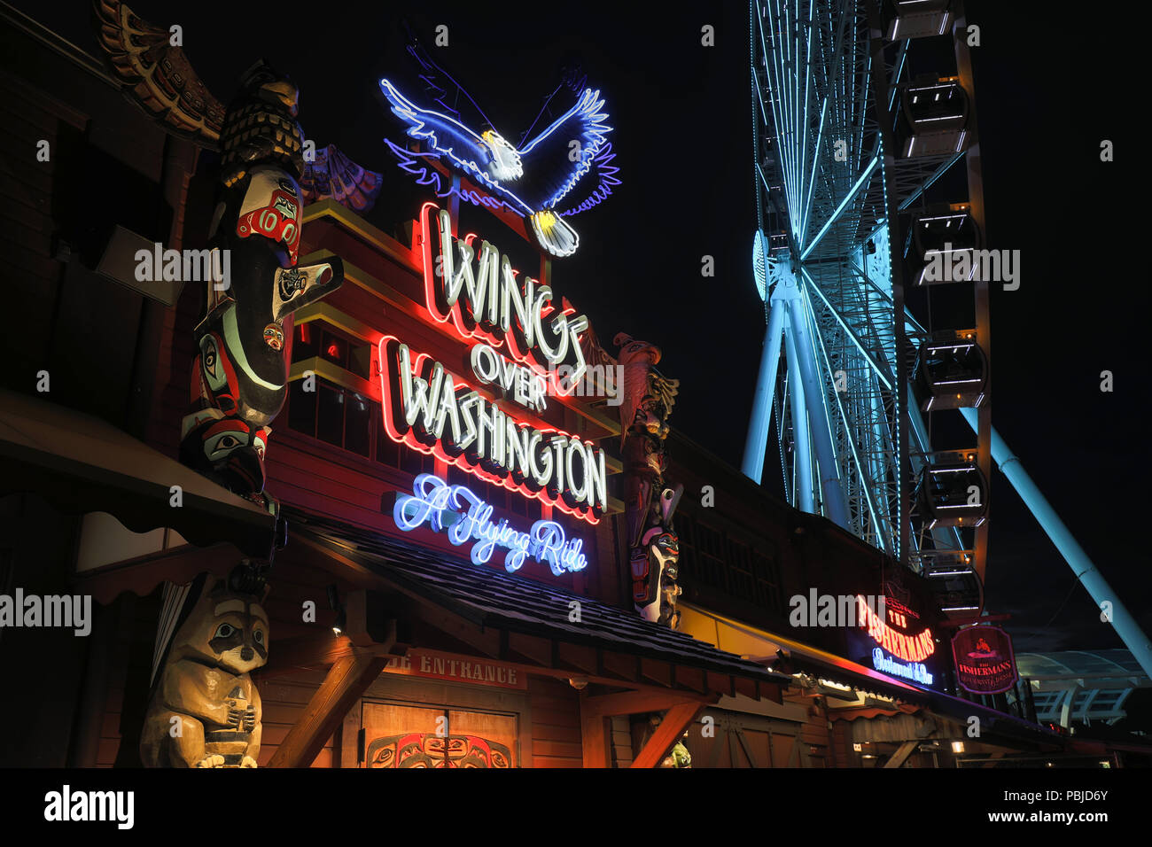 Seattle, Washington - June 30, 2018 : Pier 57 at night with neon signs ...
